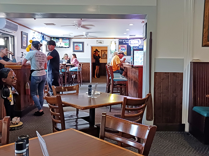 Inside, the cozy nautical vibe feels like you've stumbled into a local fisherman's favorite hideaway. That warm wood paneling isn't trying too hard—it doesn't need to.