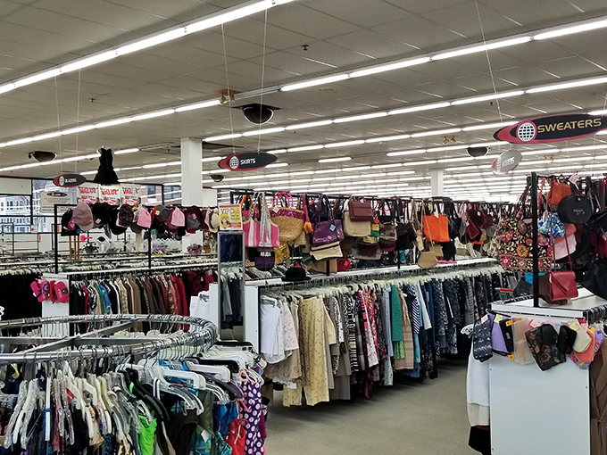 A sea of clothing racks stretches to the horizon. The thrill of the hunt begins as you navigate this organized chaos of potential finds.