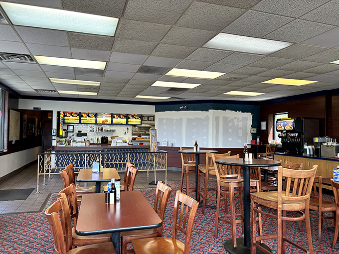 No-frills dining at its finest—wooden chairs, patterned carpet, and the promise of crispy seafood delights await in this unpretentious time capsule of American fast food history.