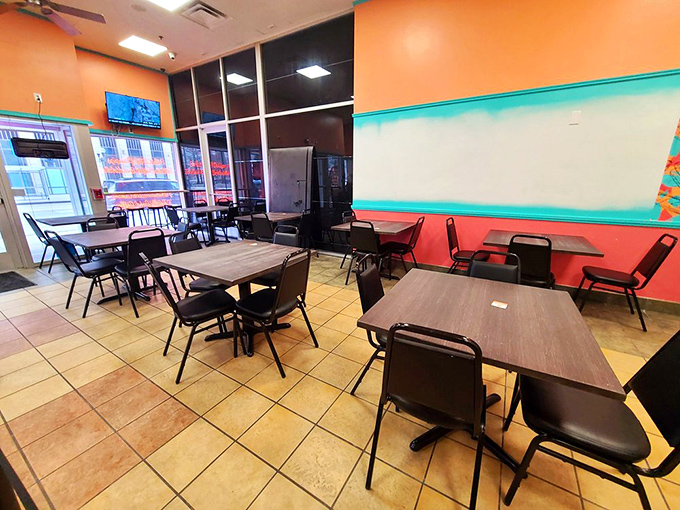 Simple tables, vibrant walls, and zero pretension—just the kind of place where the food does all the talking and napkins are absolutely necessary.