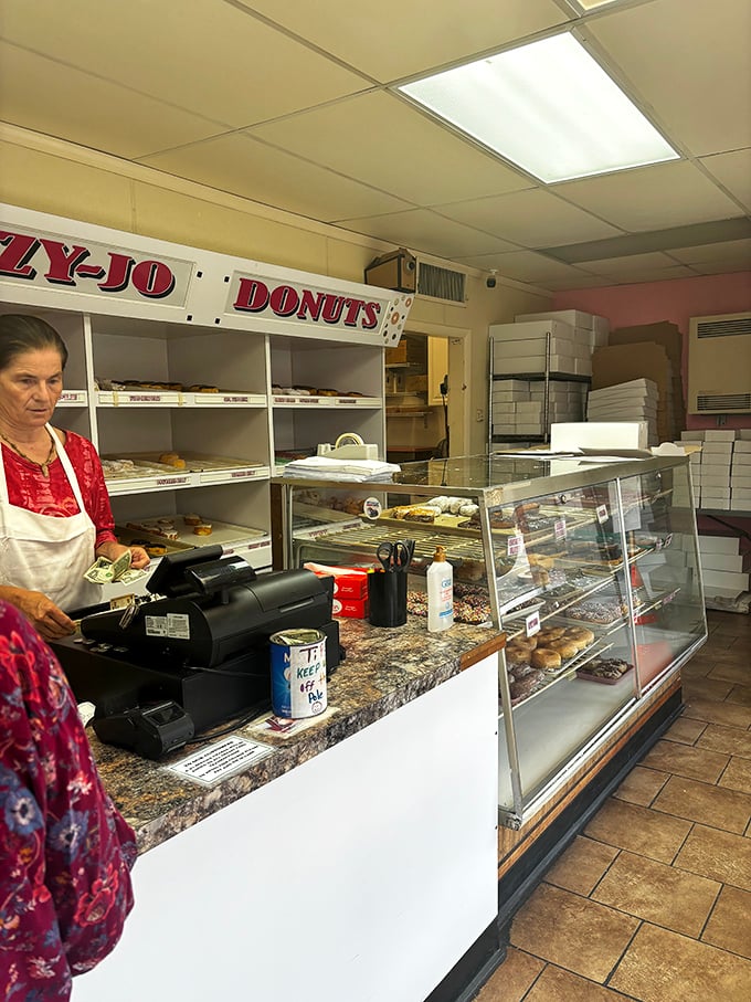 Behind the counter, where donut magic happens daily. No fancy equipment needed—just decades of know-how and dedication to craft.