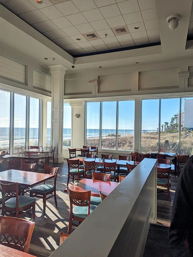 Floor-to-ceiling windows frame the Gulf like a living painting, turning every meal into dinner and a show.