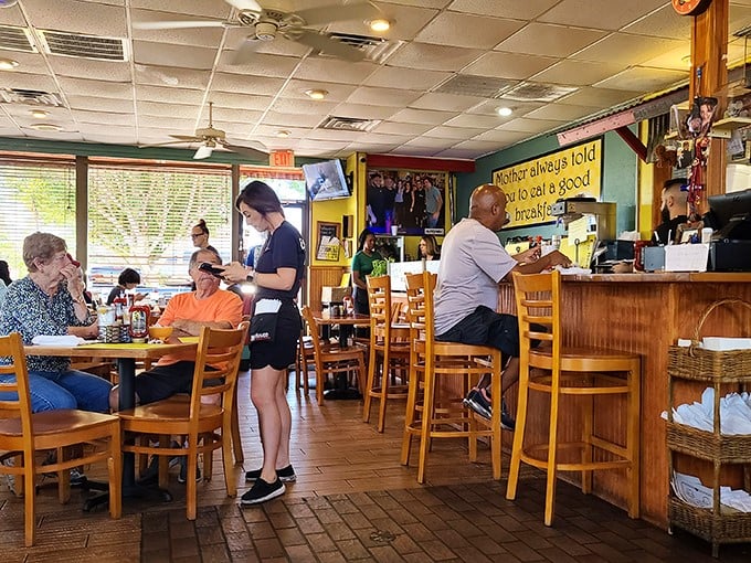 Inside, wooden chairs and homey décor create that classic diner atmosphere where conversations flow as freely as the coffee.