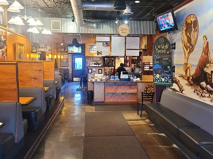 Step inside and the eclectic interior reveals itself—tin ceilings, wooden booths, and murals that make eating here feel like dining in an art gallery.