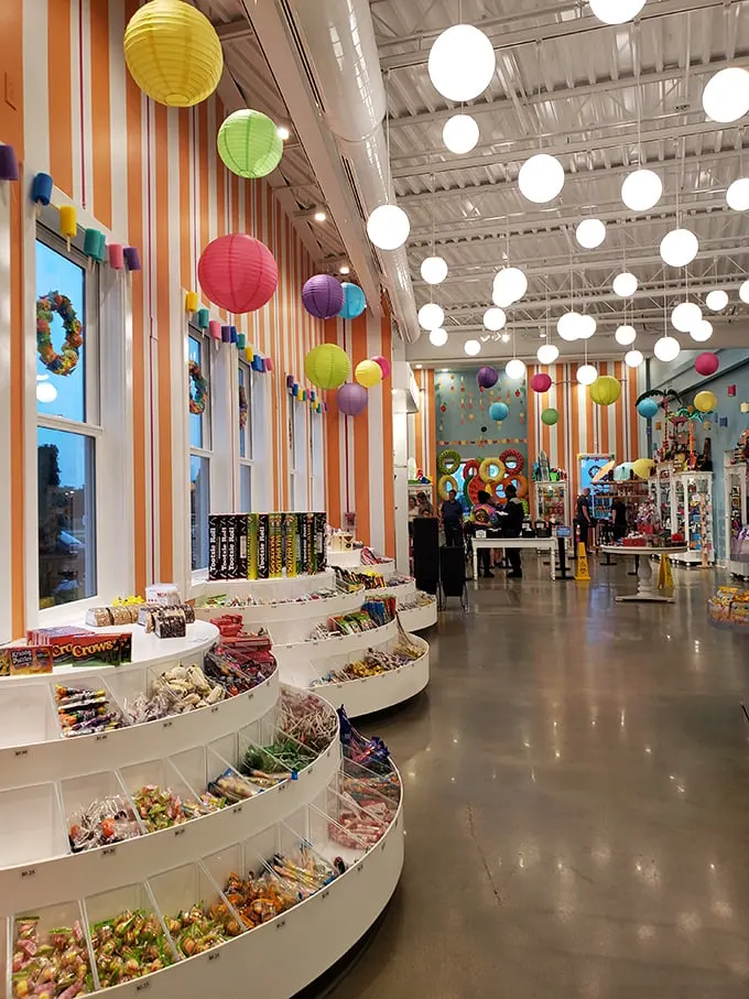 Step inside and the real magic begins – colorful paper lanterns, rainbow-striped walls, and endless candy displays that would make Willy Wonka jealous.
