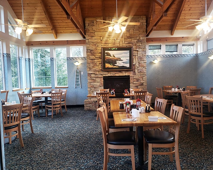 Vaulted ceilings, stone fireplace, and coastal light flooding in—this isn't just a restaurant, it's the Pacific Northwest's breakfast cathedral.