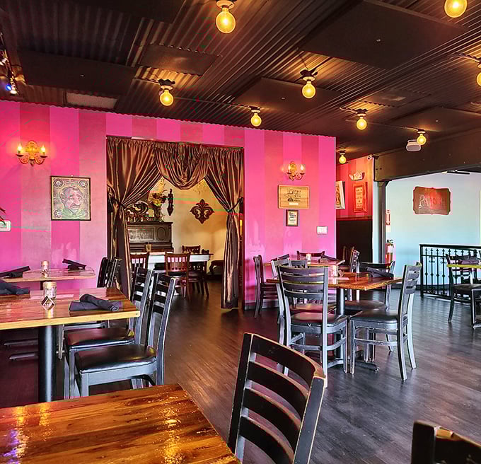 Pink walls and industrial ceilings create a space that's equal parts New Orleans speakeasy and Arizona oasis. Somehow, it works magnificently.