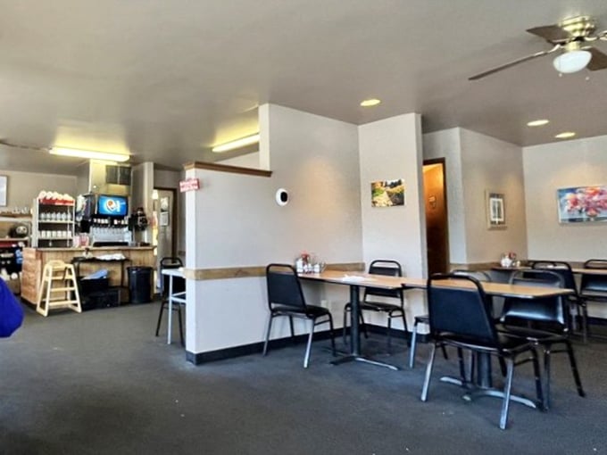 Inside, simplicity reigns supreme—no fancy frills here, just clean tables and comfortable chairs awaiting your breakfast adventure.