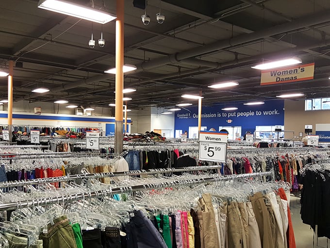 Organized chaos at its finest—rows upon rows of potential wardrobe upgrades await under the watchful gaze of fluorescent lighting.