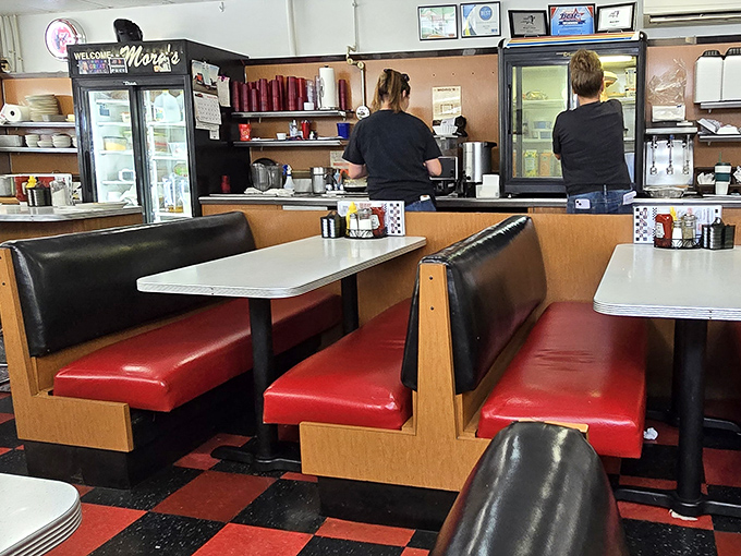 Classic red vinyl booths and checkerboard floors – this isn't retro design, it's the real deal that's been serving comfort for decades.