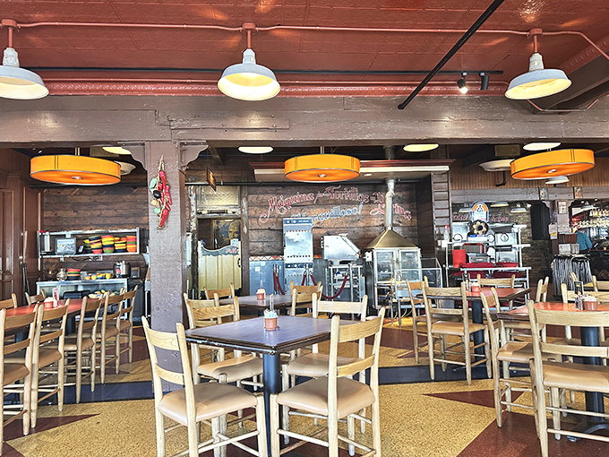 The dining room's warm wooden tables and pendant lighting create that perfect "I'm about to have a really good meal" atmosphere we all crave.