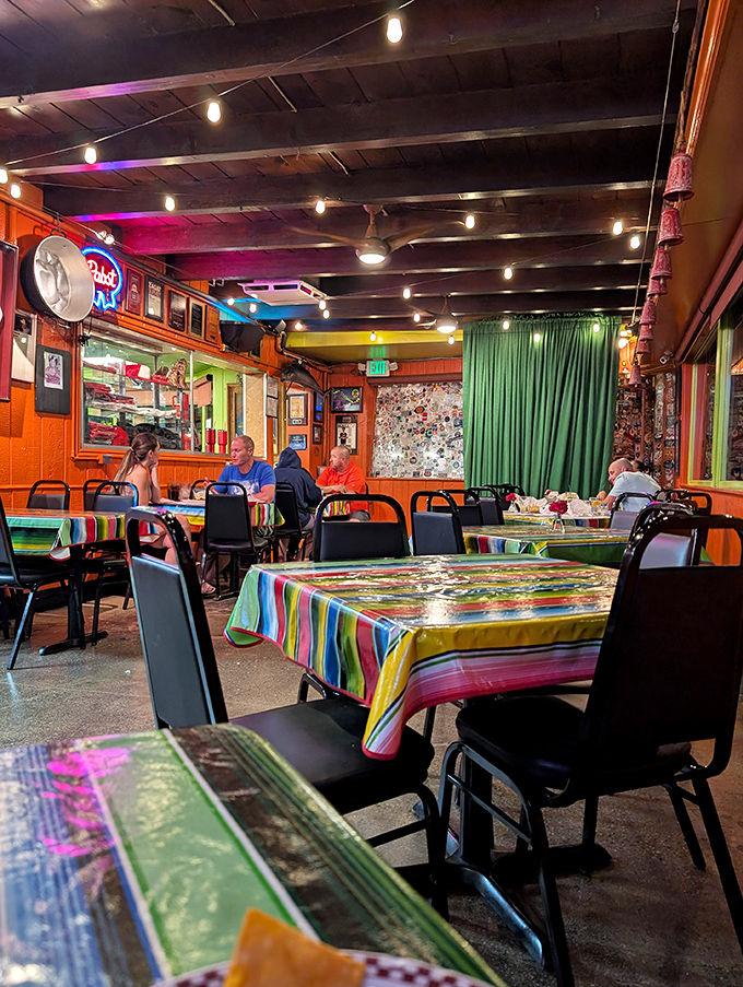 Step inside and you're greeted by vibrant serape tablecloths, wooden beams, and the unmistakable buzz of happy diners. This isn't ambiance you manufacture – it's earned.