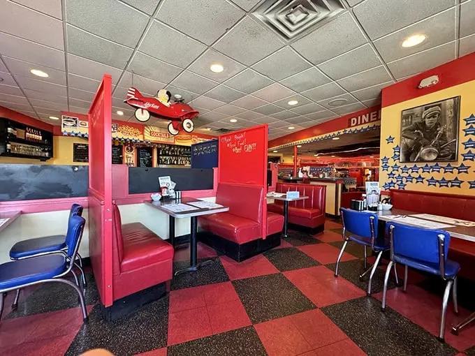 Classic red vinyl booths and checkerboard floors—this isn't retro design, folks, it's authentic Americana that never went out of style in the first place.