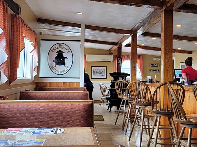 Wooden beams, country curtains, and classic Windsor chairs—this isn't designer farmhouse chic, folks. It's the real New England deal.
