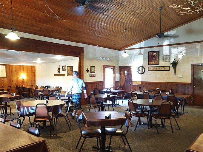 Knotty pine walls and wooden ceiling beams create the perfect backdrop for memorable meals. This isn't dining—it's time travel to when conversations mattered more than cell service.