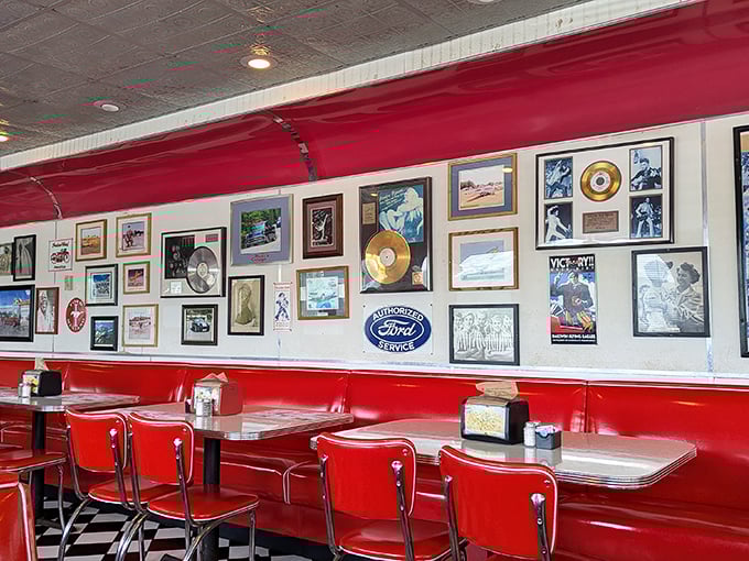 The walls tell stories that jukeboxes can't, with memorabilia that transforms simple red vinyl booths into front-row seats to America's golden age of rock and roll.