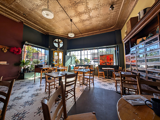 Step inside to discover ornate tin ceilings, warm wood tones, and an atmosphere that somehow manages to be both elegant and completely unpretentious.