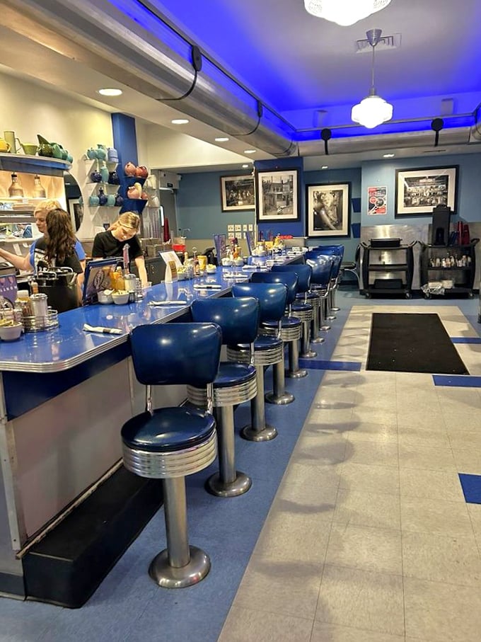 Classic Americana comes alive at the counter, where those blue vinyl stools aren't just seats—they're front-row tickets to comfort food theater.