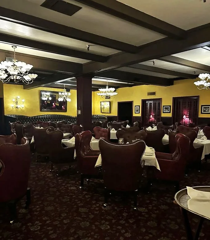 Step inside and time slows down—yellow walls, dark wood beams, and leather chairs create that rare atmosphere where "fancy" meets "feels like home."