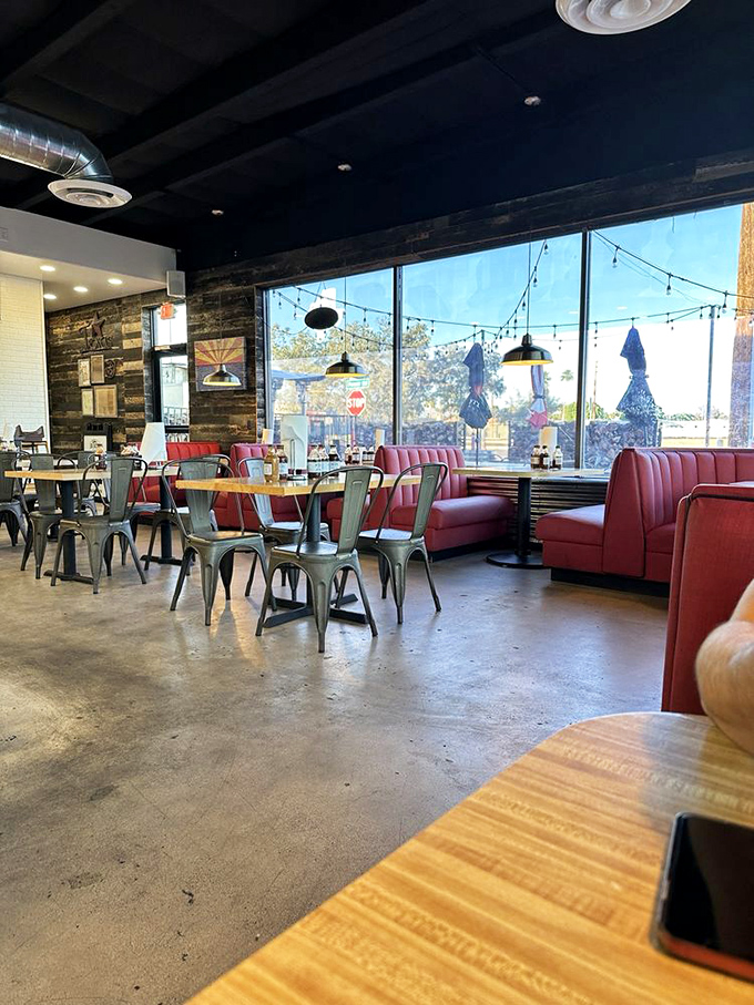 Modern rustic meets meat sanctuary. Those red booths have witnessed countless "first bite" faces—you know, that involuntary eye-closing moment of pure joy.