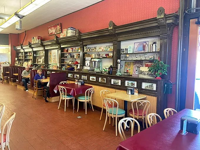 Step inside and the magnificent wooden back bar tells you this isn't some corporate "retro" knockoff—this is authentic Americana preserved with care.