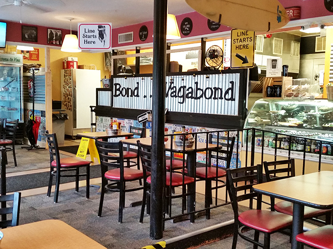 Inside, the "Line Starts Here" signs aren't just decoration—they're necessary landmarks for navigating the daily pilgrimage of sandwich seekers.