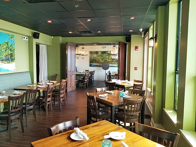 The dining room's soothing green walls and wooden tables create that perfect "ahh, vacation" feeling—casual elegance without a hint of pretension.