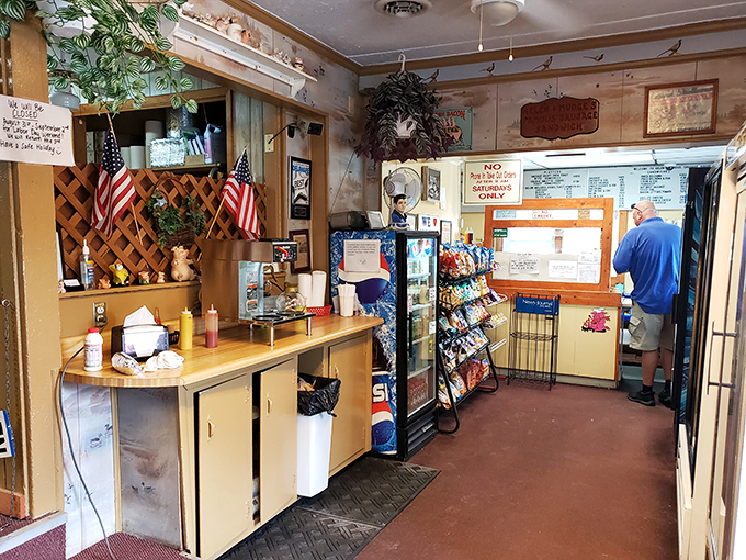 No fancy interior design awards here—just the honest charm of wood paneling, American flags, and the promise of breakfast nirvana.