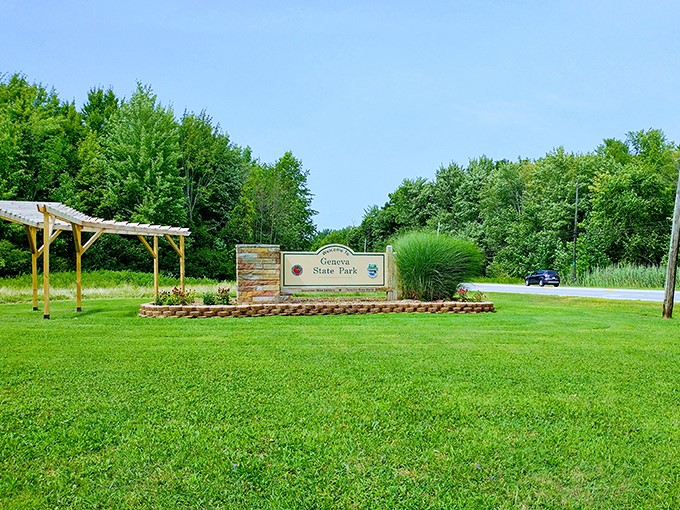The welcoming gateway to adventure – Geneva State Park's entrance sign promises 698 acres of lakeside magic waiting to be discovered.
