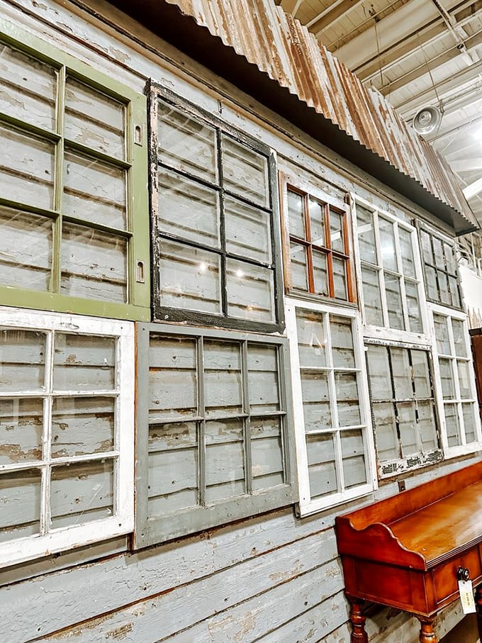A gallery of architectural ghosts—these vintage window frames aren't just building materials, they're portals to history, each pane telling stories of the Baltimore homes they once illuminated.
