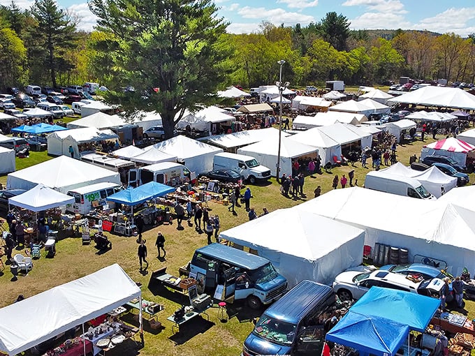 Brimfield from above—a patchwork quilt of white tents where thousands gather for America's antique Super Bowl.
