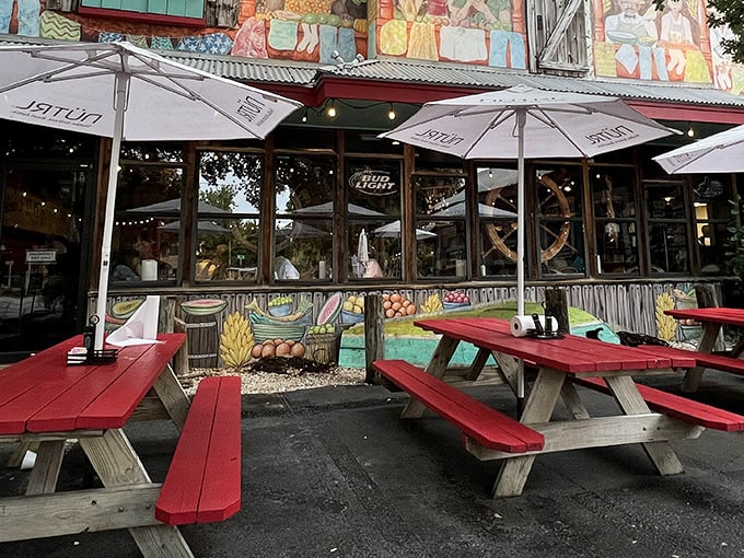 Red picnic tables and colorful murals – Fourth Street Shrimp Store serves up Florida vibes with a side of sunshine.