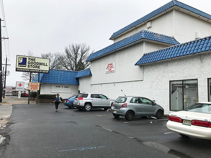That iconic blue roof signals thrifting territory ahead! Pull over and prepare for treasure hunting.