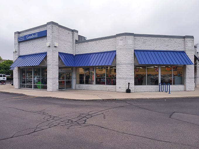 Blue awnings and big promises. This Goodwill storefront is the gateway to secondhand heaven.