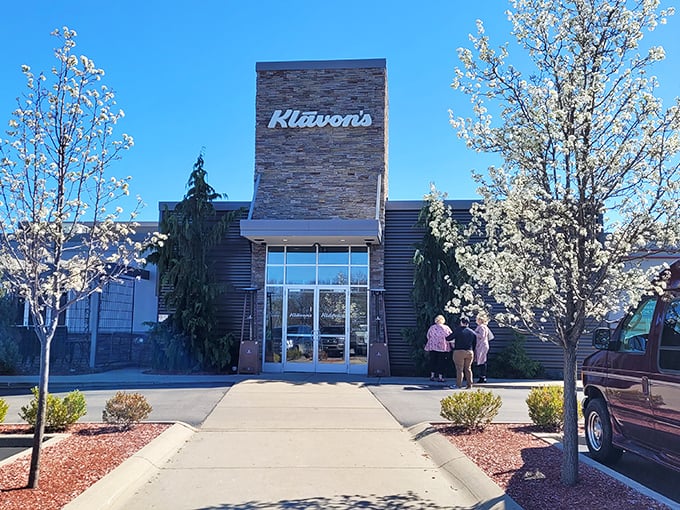 Klavon's modern stone facade hides an interior where pizza dreams come true, one perfect slice at a time.