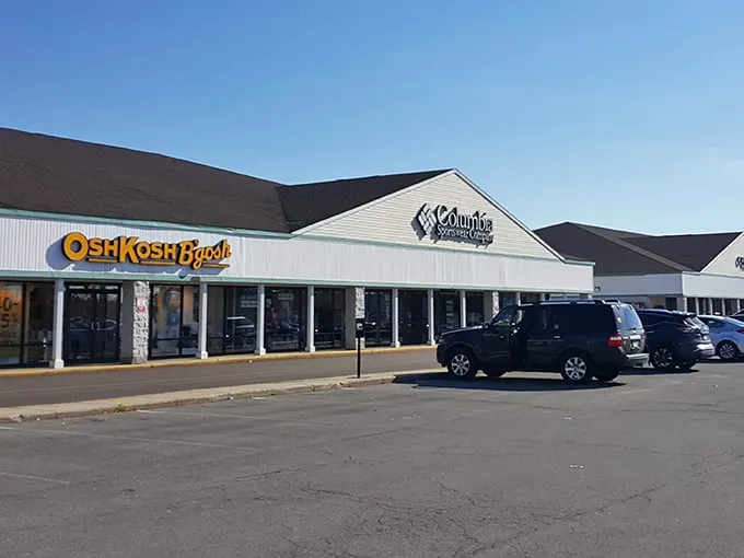 Columbia, OshKosh, and more await at Lighthouse Place, where Michigan City's outlet magic happens under classic white siding.