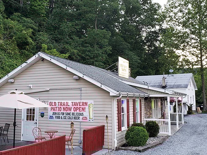 Old Trail Tavern's modest white building hides culinary greatness behind that "Patio Now Open" sign – the Clark Kent of steakhouses.