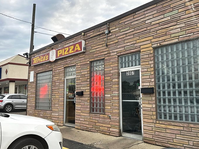 Terita's stone facade and glass block windows aren't just retro cool – they're guardians of pizza secrets worth crossing town for.