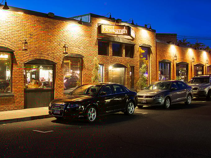 The Blacksmith's warm brick exterior invites you in like an old friend who happens to cook a mean steak.