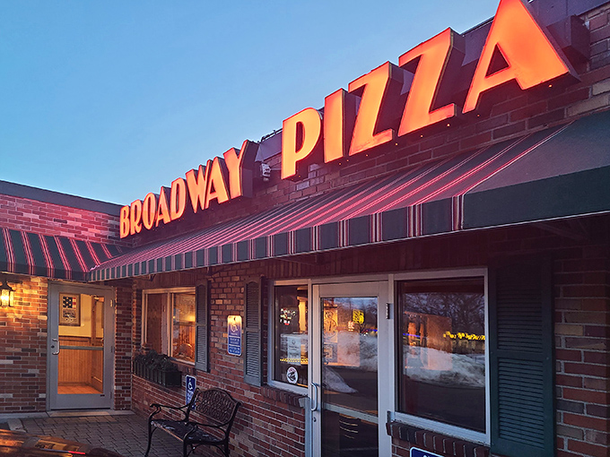 Broadway Pizza: When that neon sign glows at dusk, it's like a lighthouse guiding hungry souls to a safe harbor of cheese and dough.