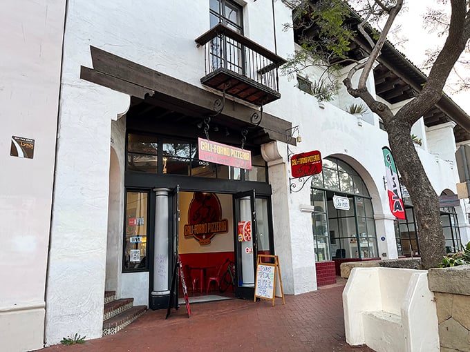 That white stucco exterior isn't just pretty—it's housing some of Santa Barbara's most beloved pizza creations.