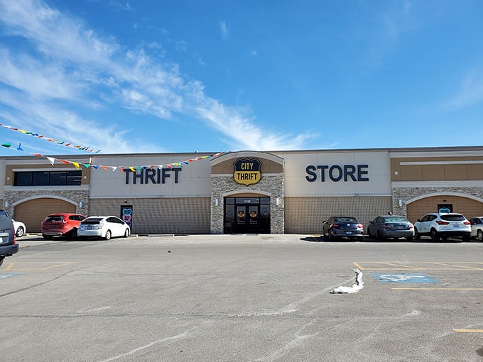 Sunlight dances across City Thrift's welcoming facade. Those colorful pennants flutter like flags marking territory worth exploring.