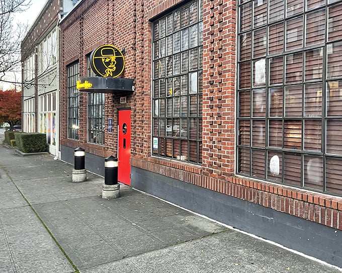 Brick, glass, and that bold red entrance: El Gaucho's facade promises old-school elegance before you even step inside.