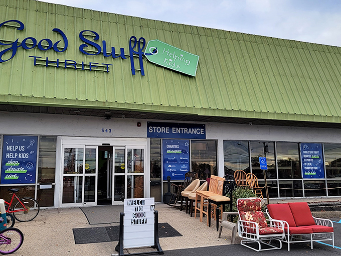 Outdoor furniture display says it all—this place is bursting with treasures. Even the sidewalk can't contain all the good stuff!
