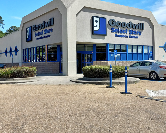 Clean lines and blue accents make this Goodwill look almost upscale—like a department store where everything comes with a backstory.
