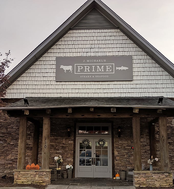 Where cabin dreams meet culinary reality. That American flag isn't just patriotic—it's signaling the all-American pleasure of perfect steak.