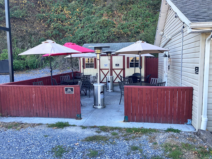 Those red fences and patio umbrellas aren't just for show – they're protecting the sacred ritual of outdoor steak enjoyment.