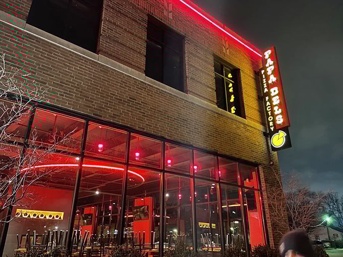 At night, Papa Del's red neon glow acts like a tractor beam for hungry students and pizza aficionados alike.