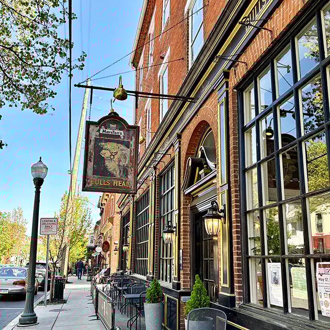 The Bulls Head Public House isn't trying to recreate England—it's channeling it, right down to the hanging pub sign that would make Shakespeare feel at home.
