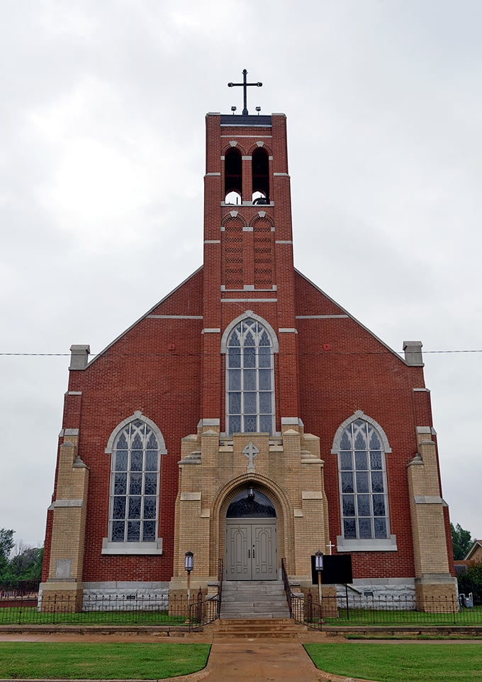 Faith and craftsmanship merge in this stunning brick church, where stained glass windows filter Oklahoma sunlight into kaleidoscopic prayers.